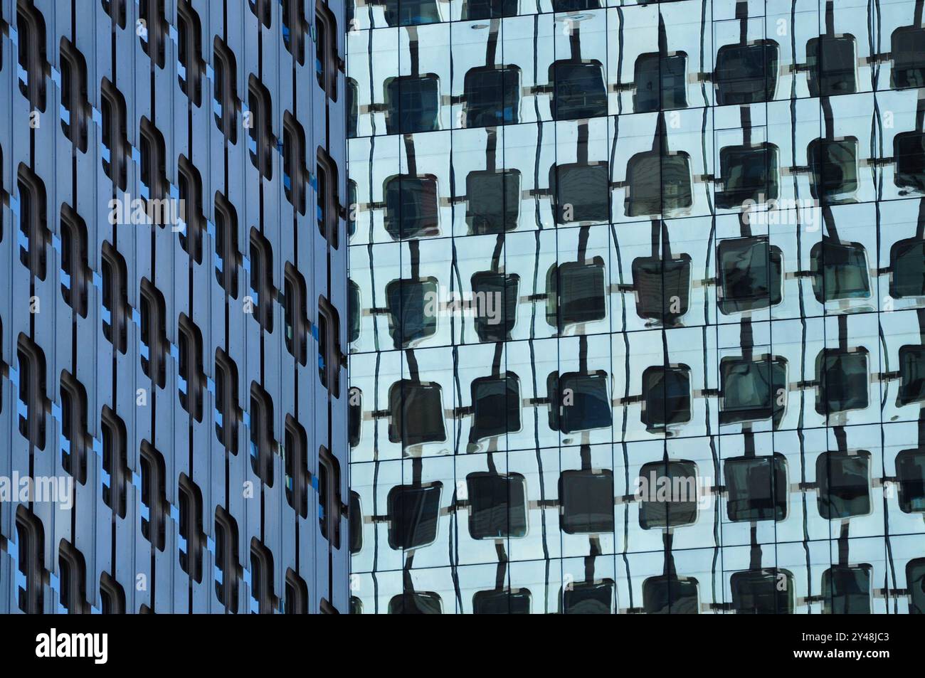 Modern geometric glass buildings reflecting urban architecture in a ...