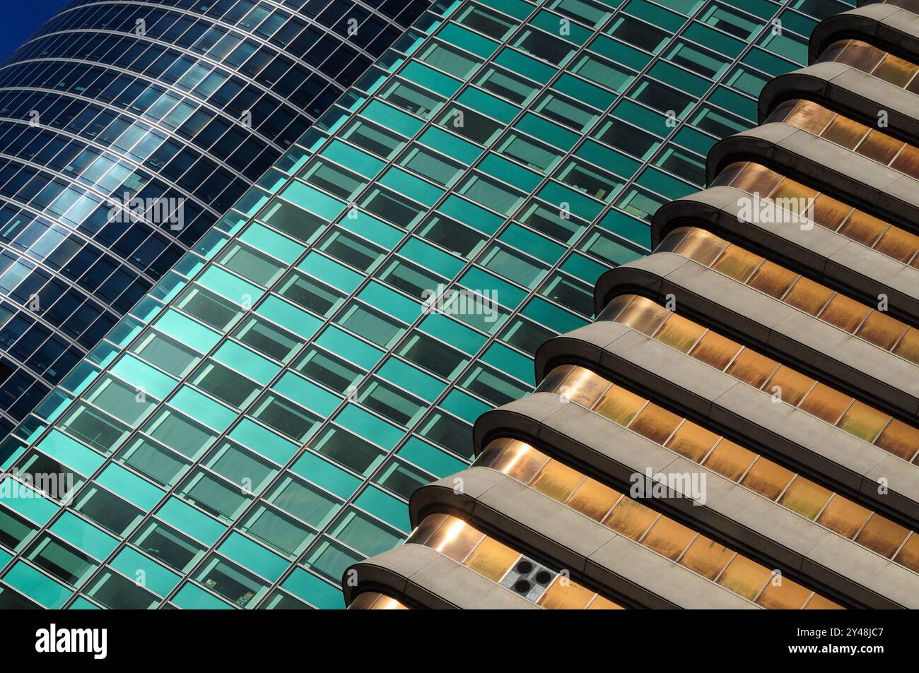 Modern urban architecture with contrasting glass and concrete textures ...