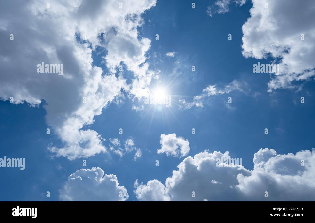 Sun lights shining through with white clouds sky background, bottom up ...