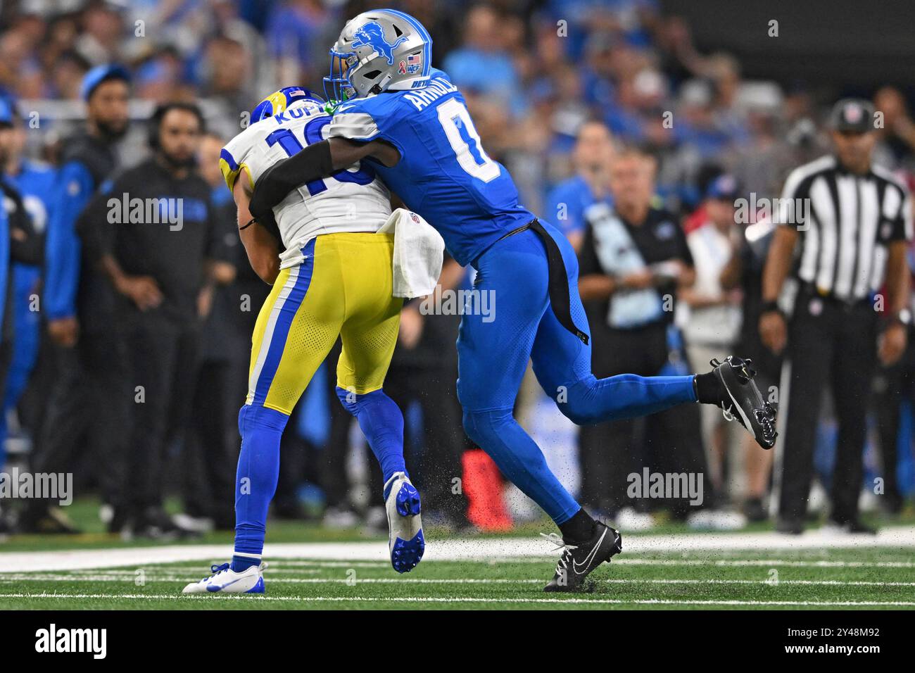Detroit Lions cornerback Terrion Arnold (0) tackles Los Angeles Rams ...