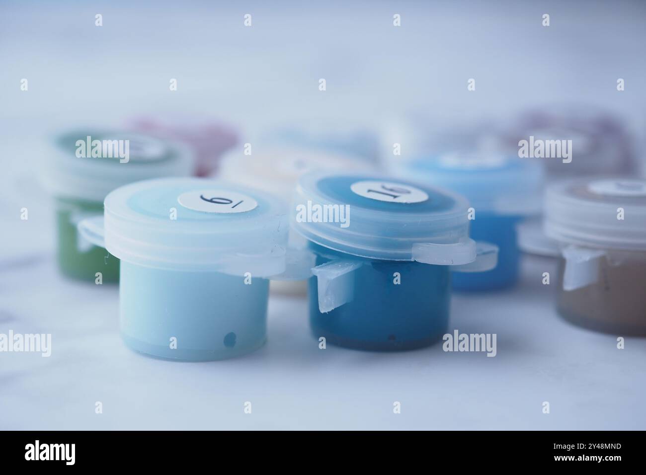 Versatile, colorful paint containers perfect for various creative ...