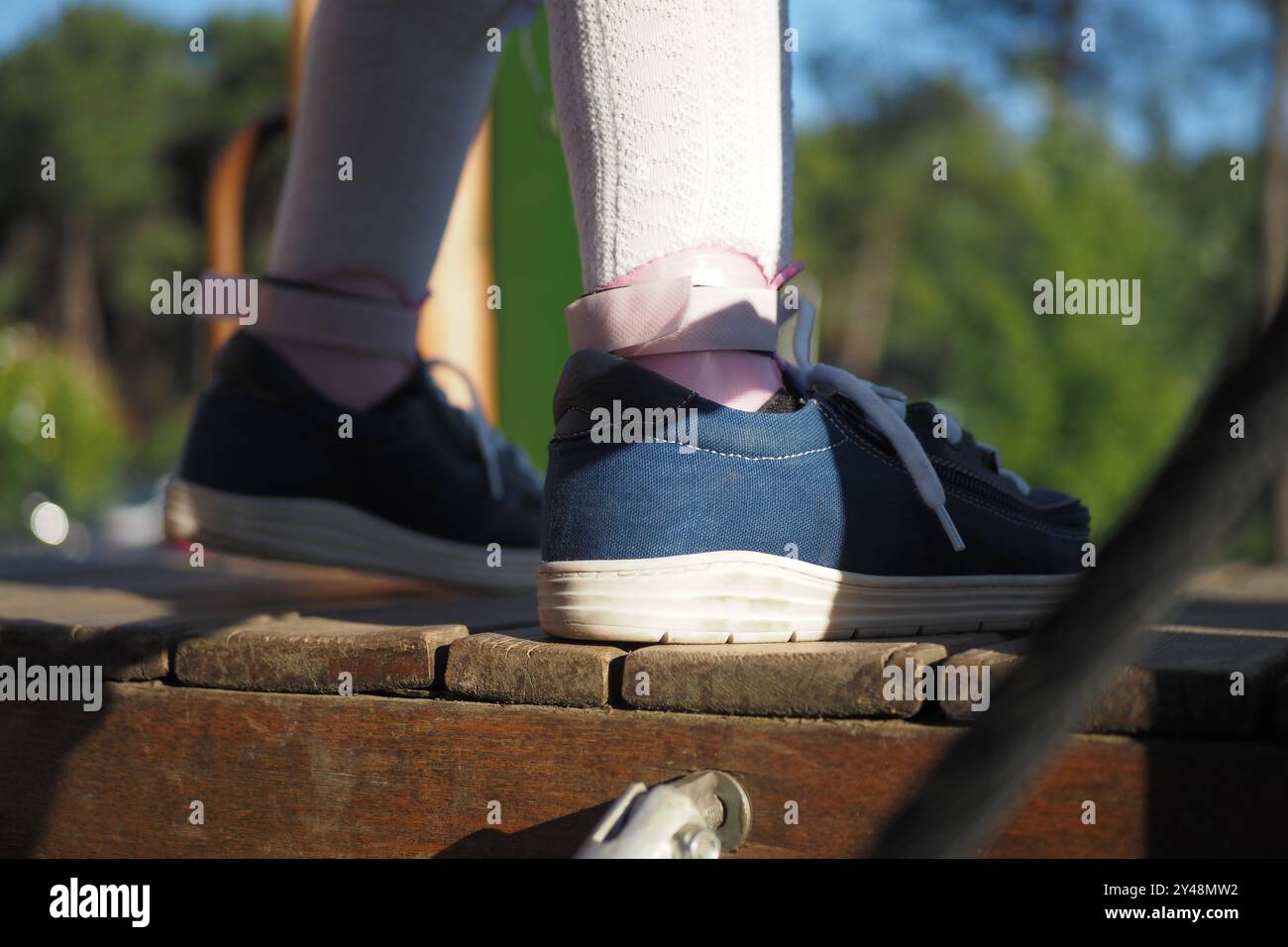 Child cerebral palsy disability, legs orthosis Stock Photo - Alamy