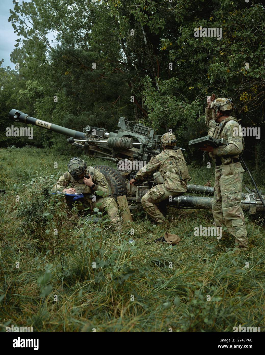 U.S. Army paratroopers with the 173rd Airborne Brigade conduct fire missions on a M119 howitzer ...