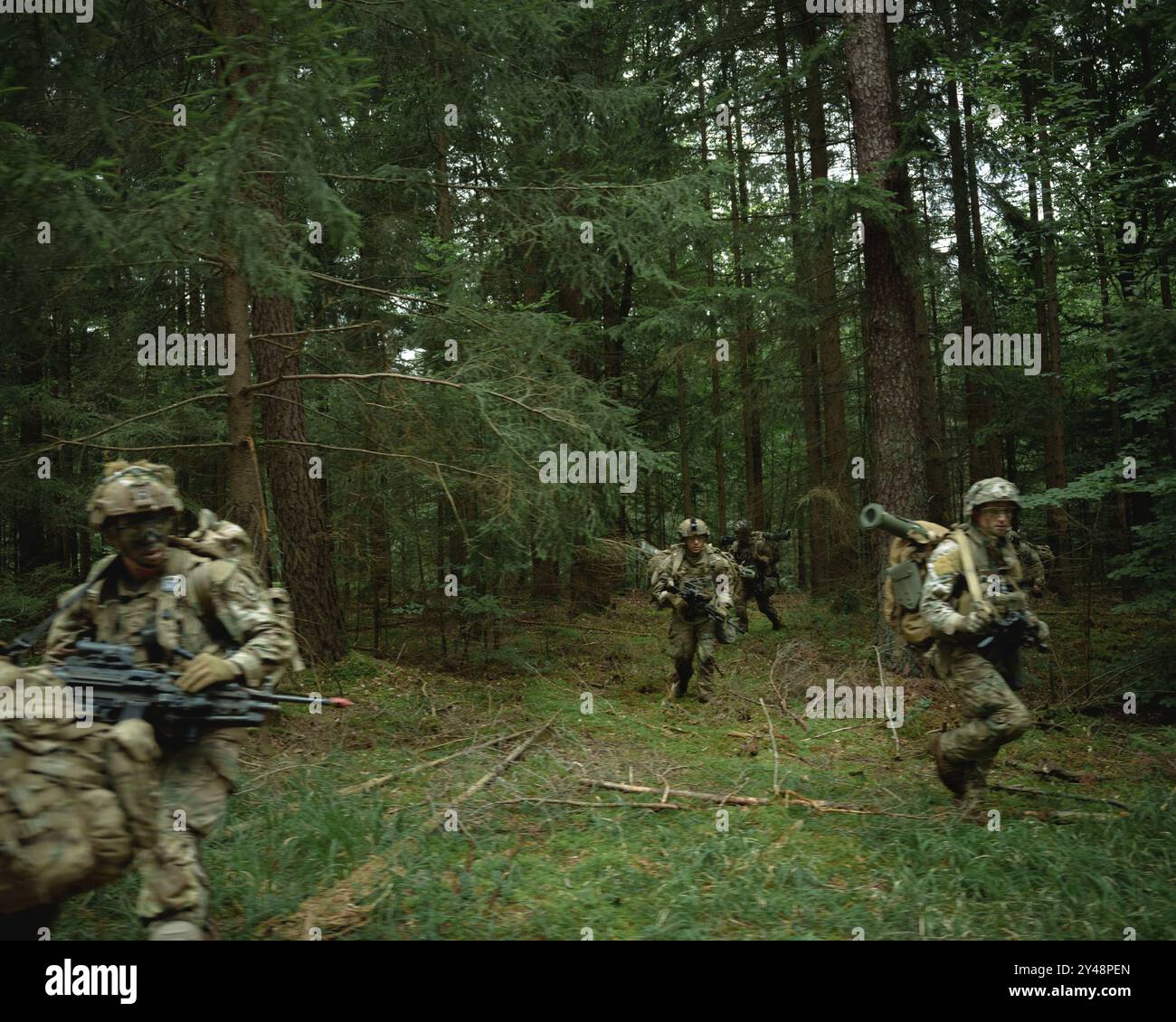 U.S. Army paratroopers with the 173rd Airborne Brigade move toward an ...