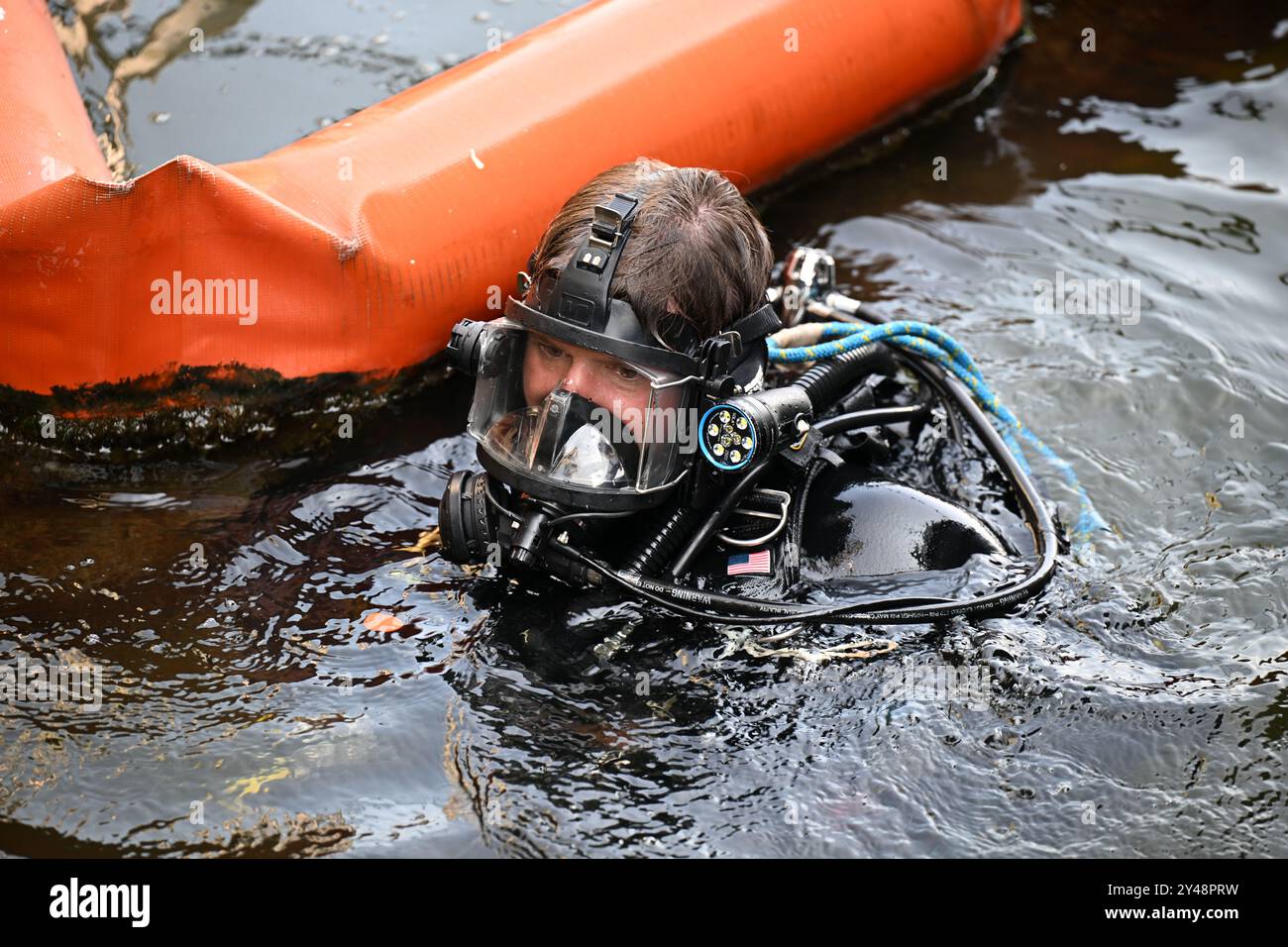Coast Guard Petty Officer 1st Class Tyler Scott, a diver with the Coast ...