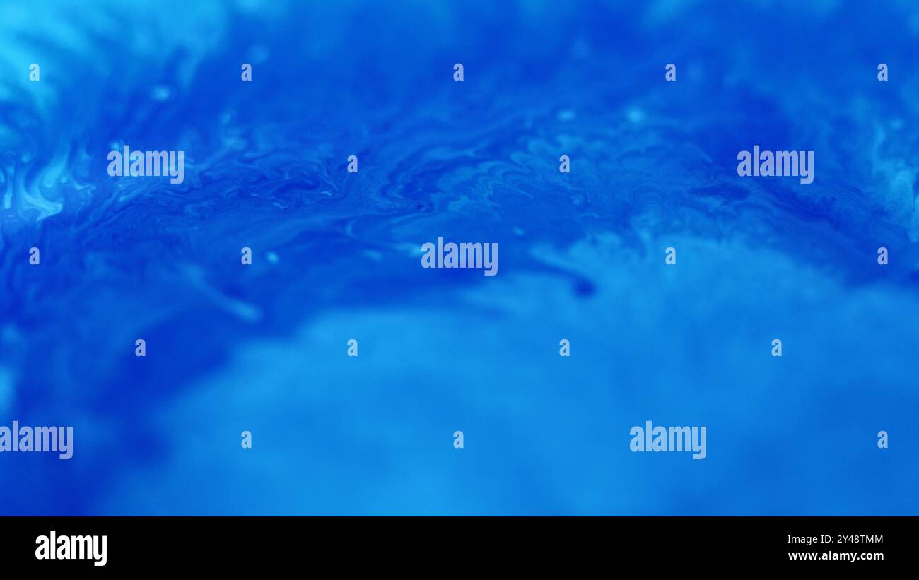 Paint splash. Fluid spill. Defocused blue color emulsion texture ...