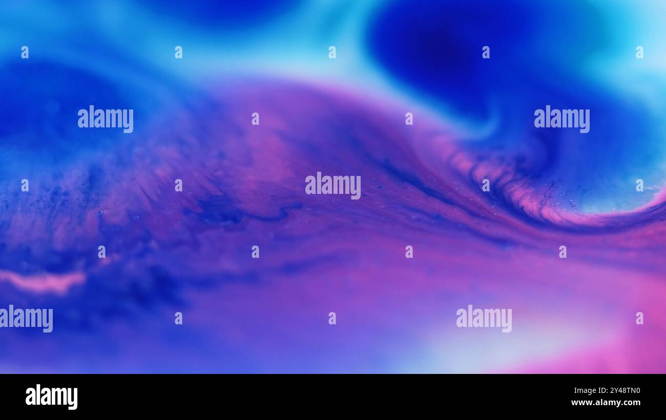 Sparkling ink wave. Paint spill. Defocused pink blue color shimmering ...