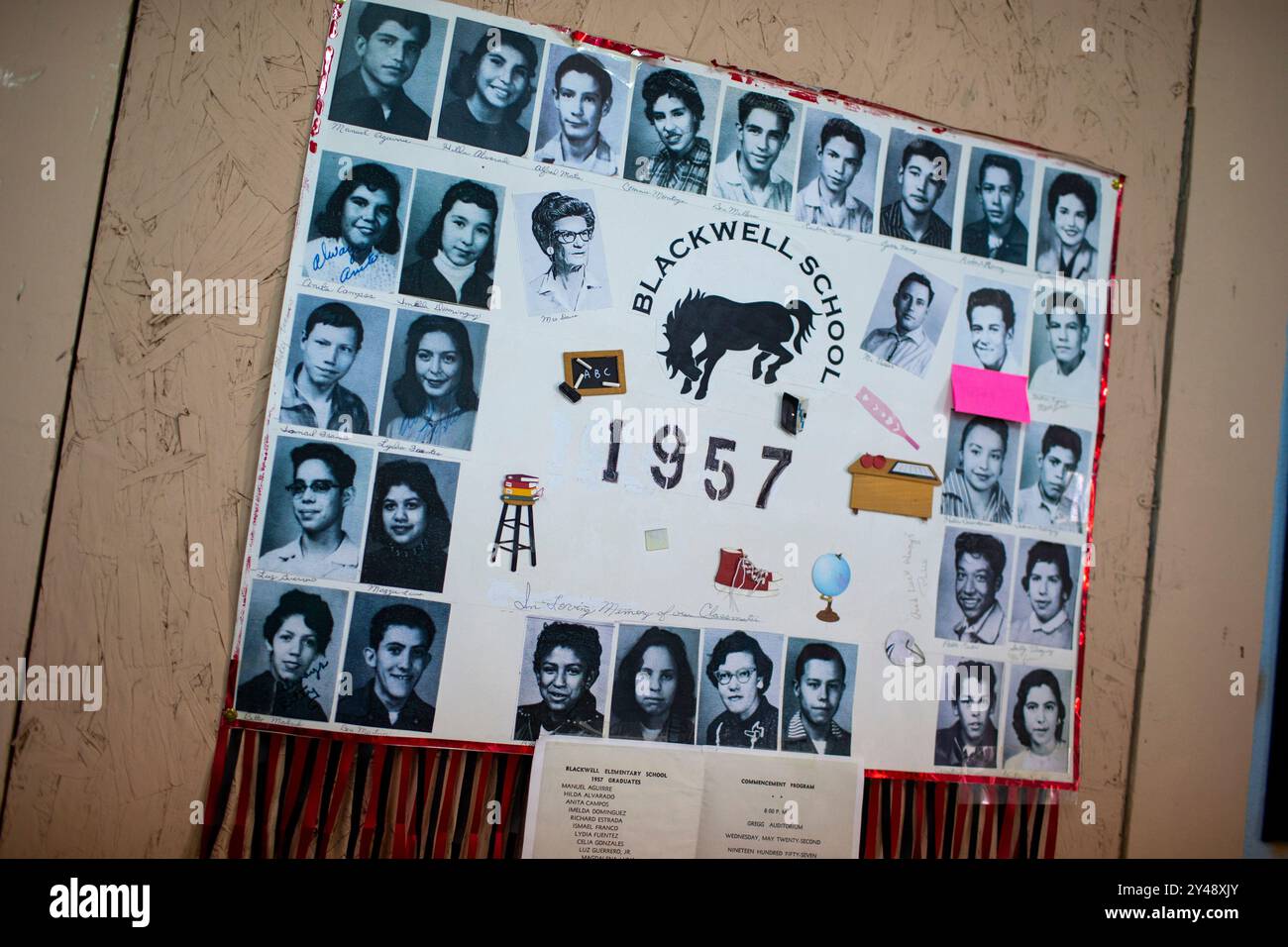 A display with photos of the 1957 class of the Blackwell School ...