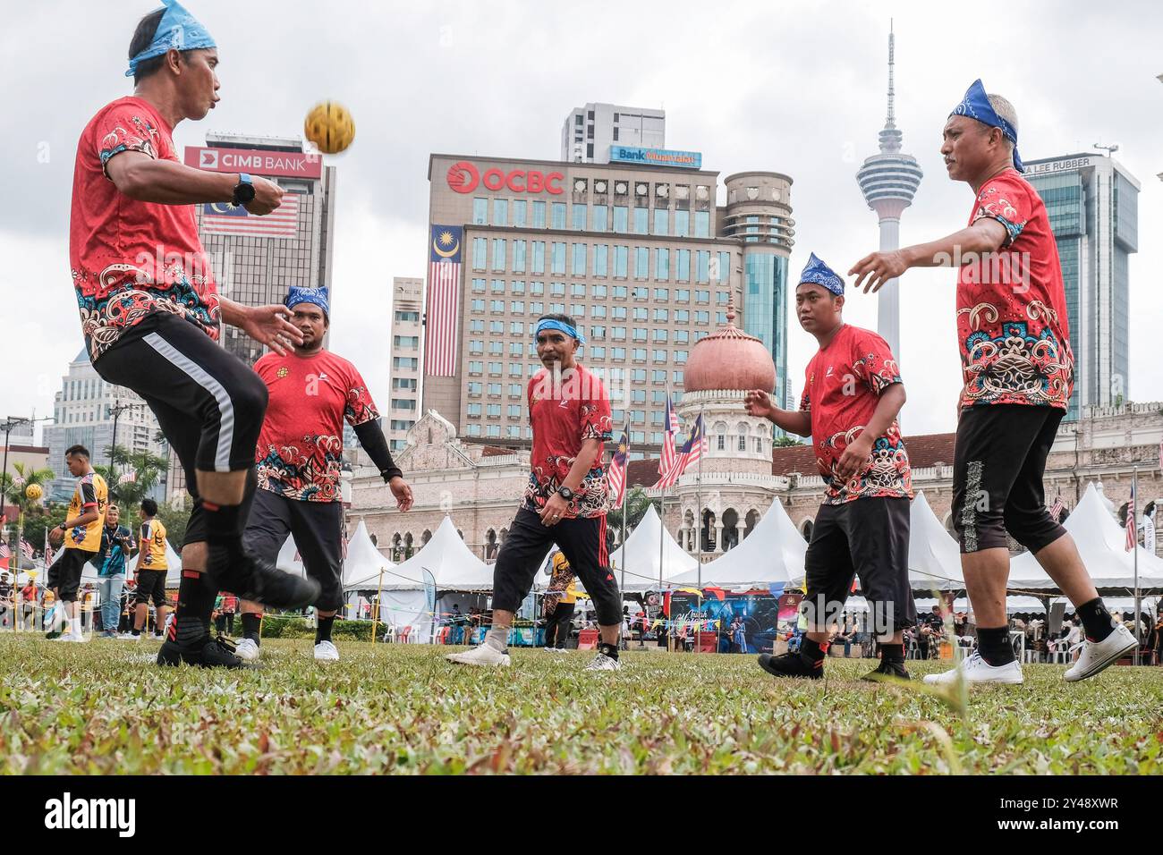 A group of men plays a traditional games known as Sepak Raga during the ...