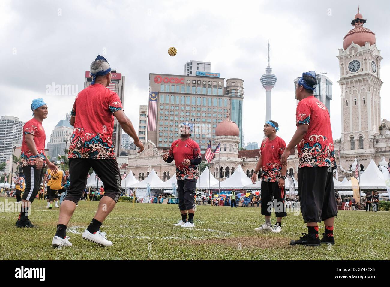 A group of men plays a traditional games known as Sepak Raga during the ...