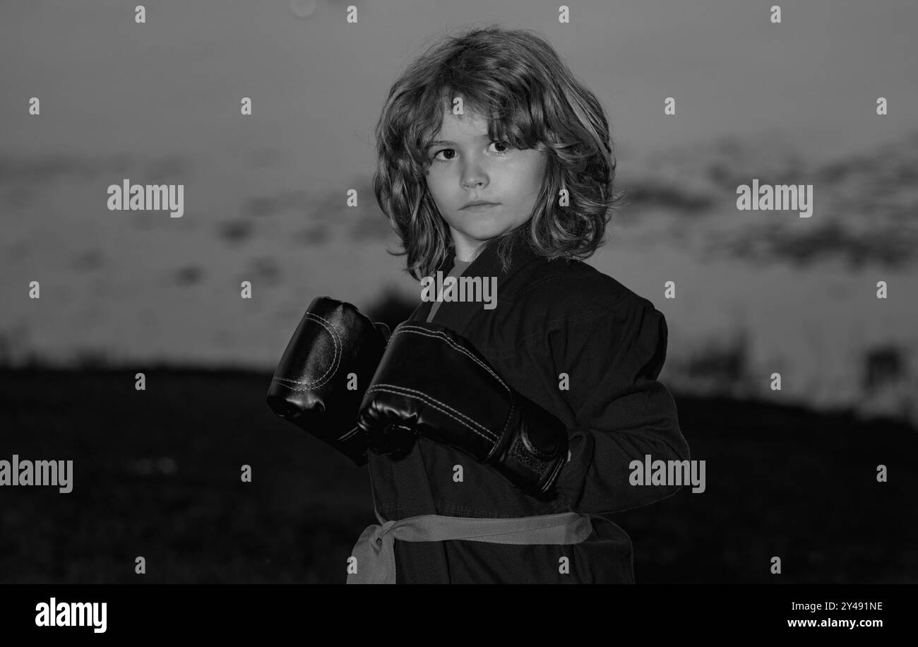 Little karate fighter. Kid boy practicing karate outdoor. Sport karate ...