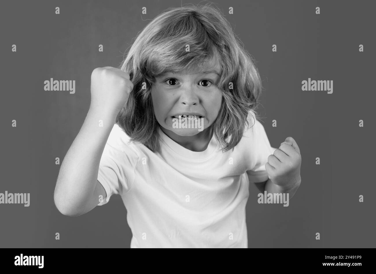 Child with angry expression in studio. Angry hateful little boy, child ...