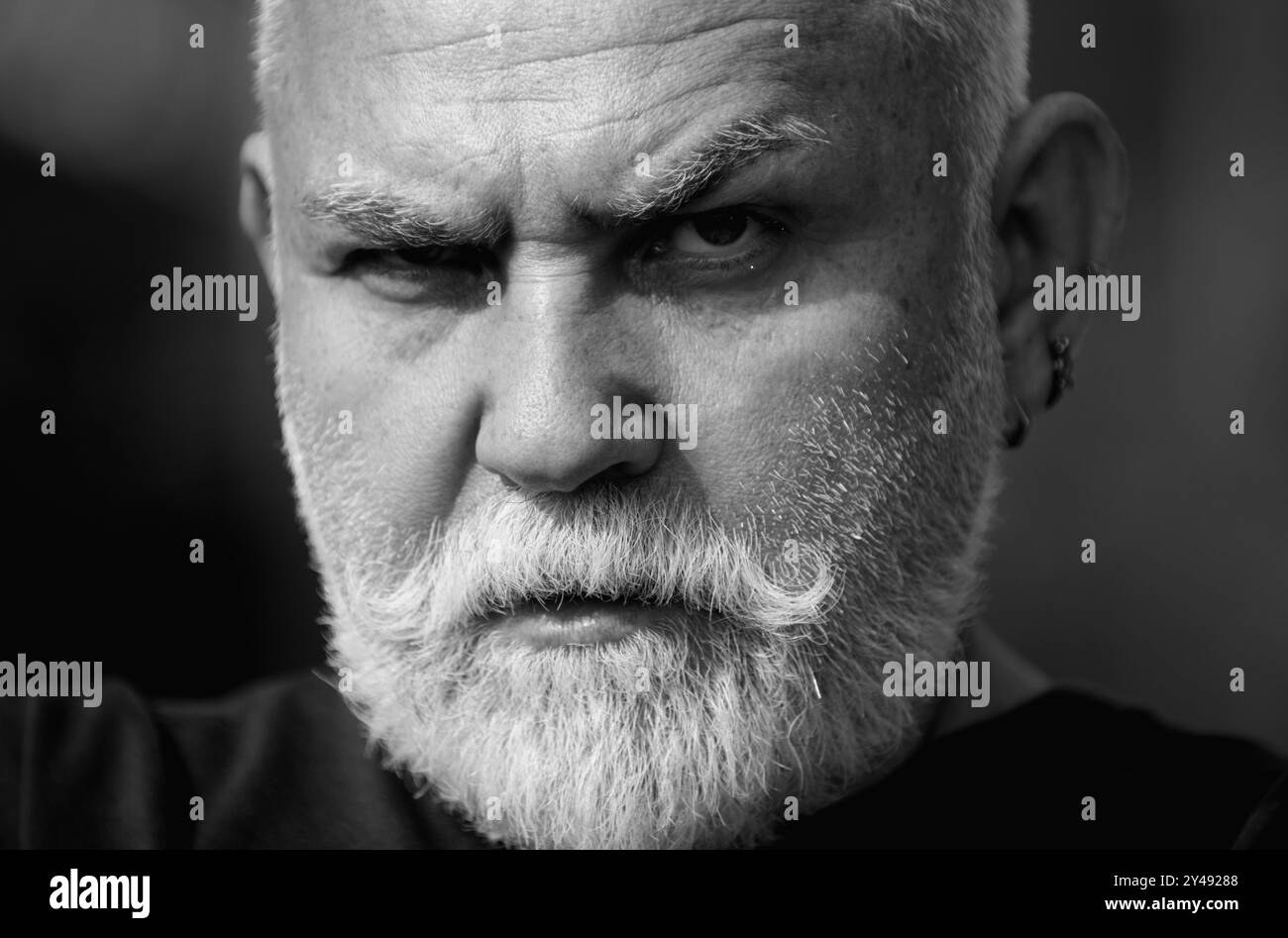 Close up portrait of serious expression 60 year old elder senior man ...