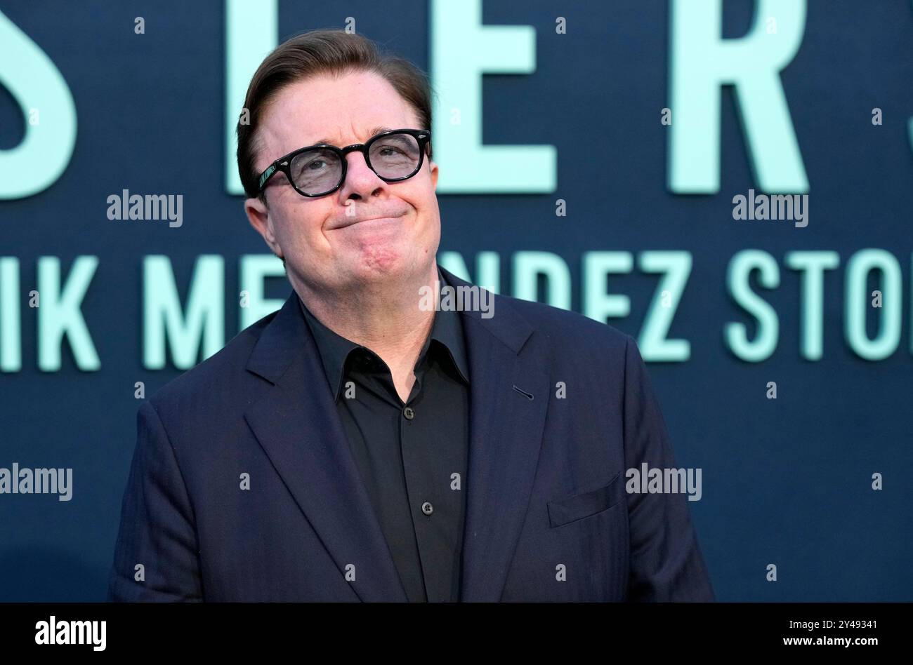 Nathan Lane poses at the premiere of the Netflix series "Monsters: The ...