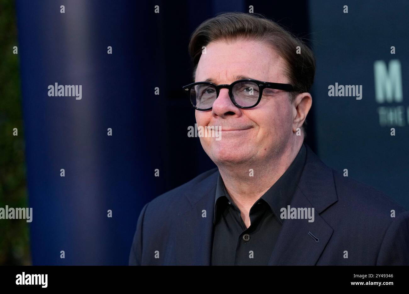 Nathan Lane poses at the premiere of the Netflix series "Monsters: The ...