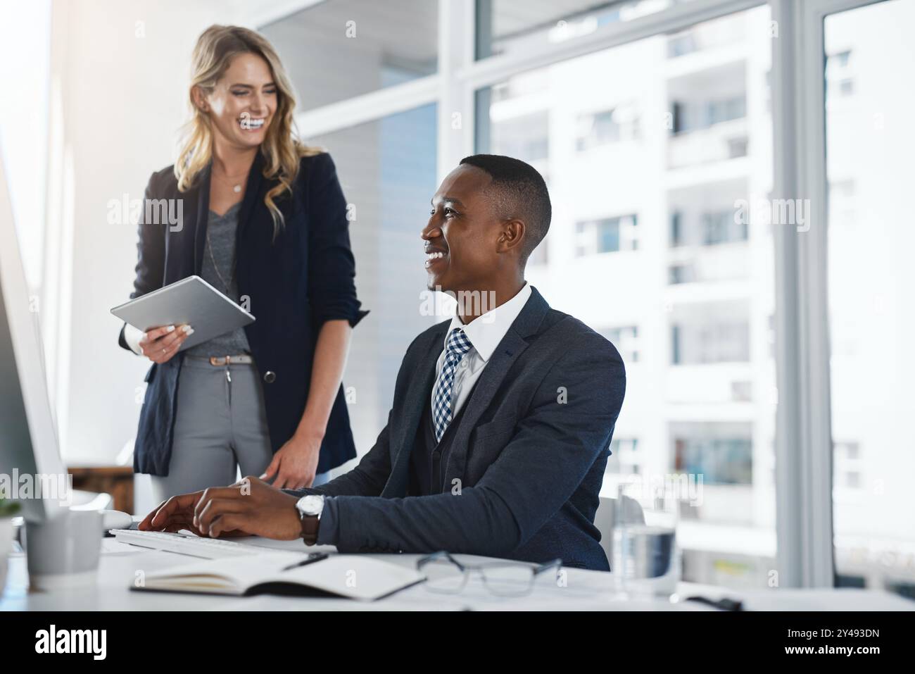 Male manager helping colleagues project hi-res stock photography and ...