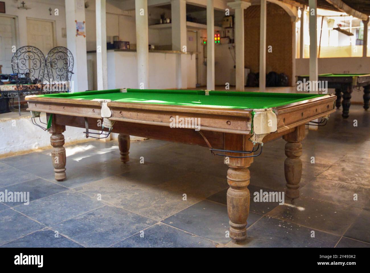 GOA, India - February 22, 2024: An old billiard table on the summer ...