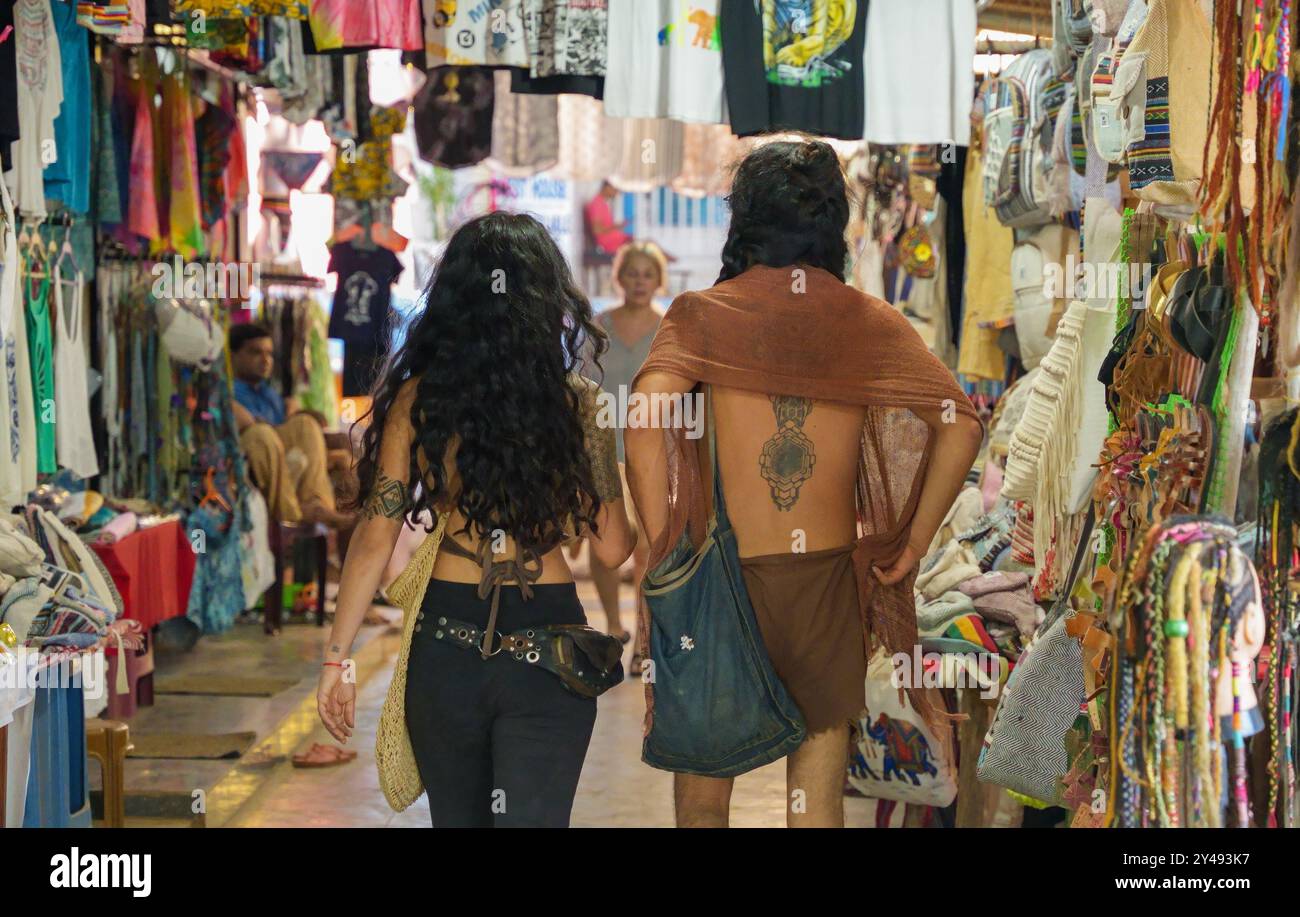 GOA, India - February 22, 2024: Two hippie girls walk through the ...