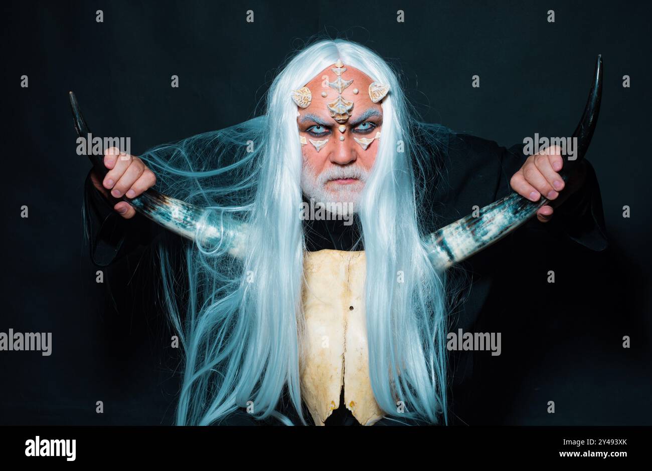 Bearded old man dressed like Halloween monster. Evil vampire man. Devil ...