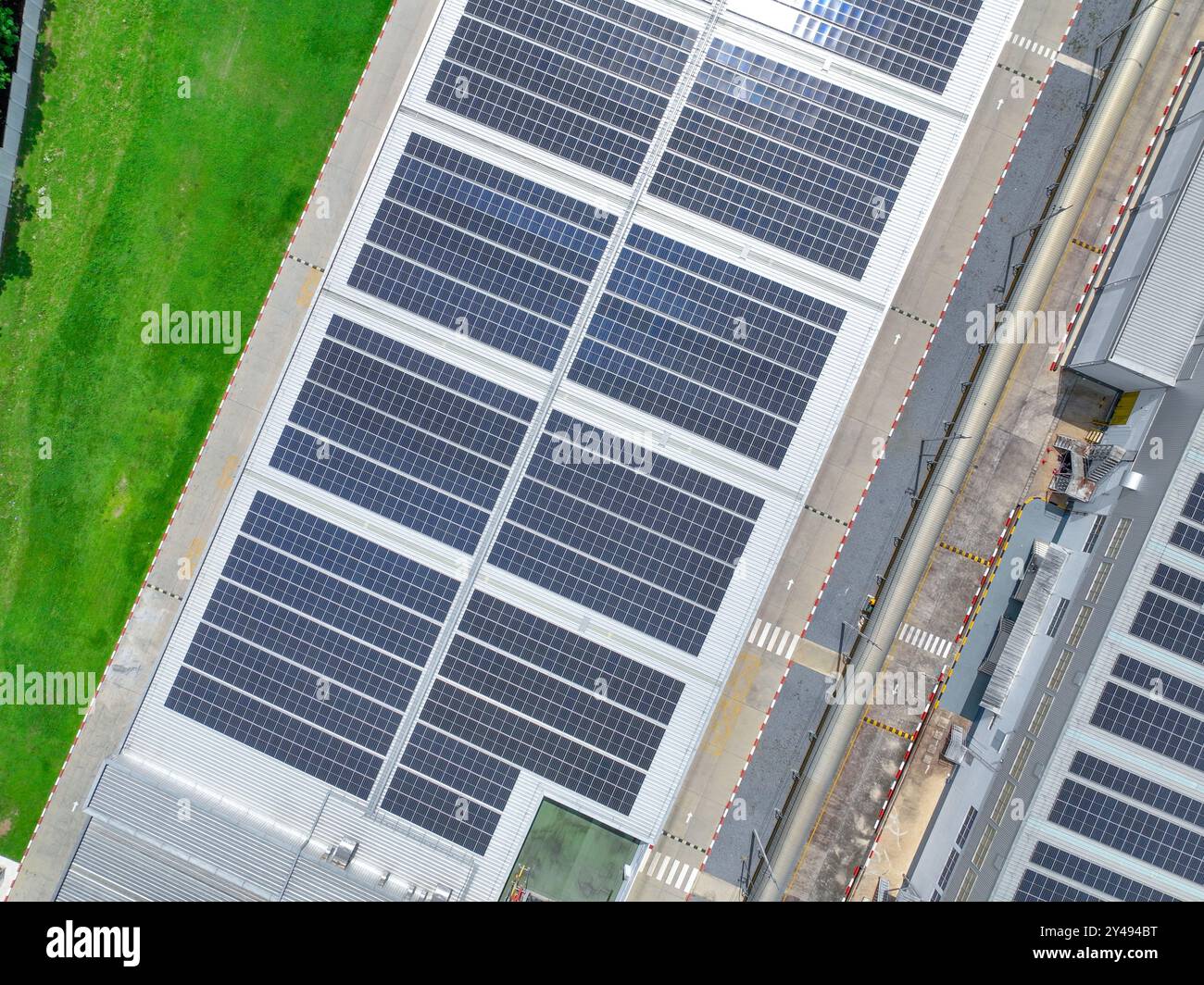 Solar energy for factory and warehouse building. Solar panels on roof ...