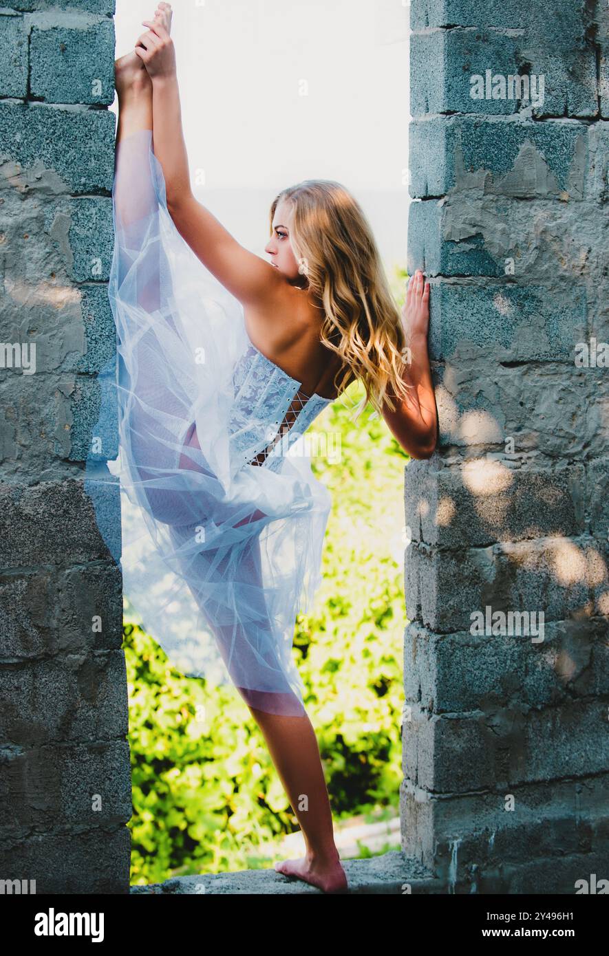 Art ballet. Young ballerina, ballet dancer. Woman stretching. Leg-split ...