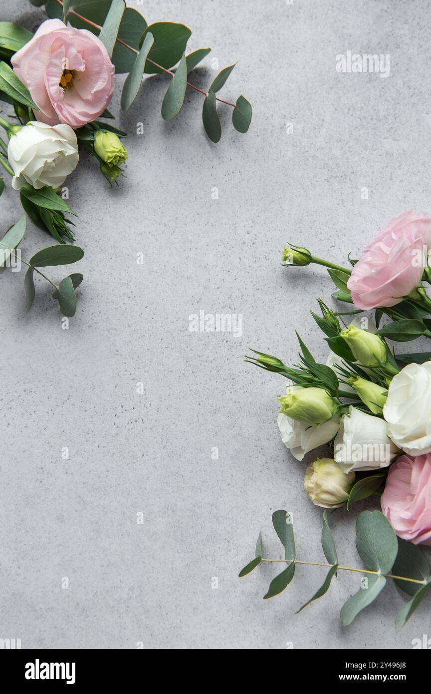 A beautiful assortment of pink, white, and cream flowers are artfully ...
