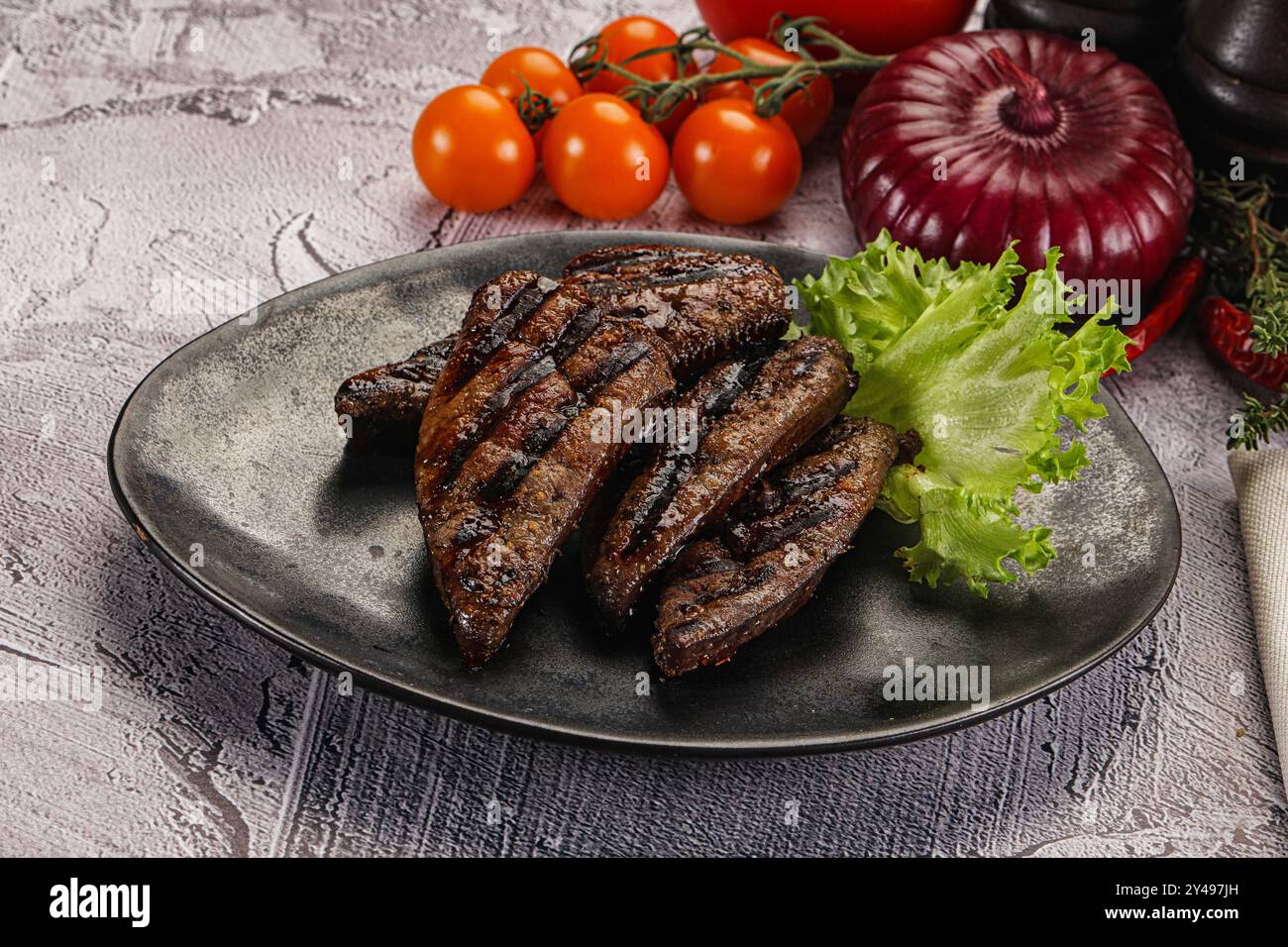 Grilled diet beef liver steak in the plate Stock Photo - Alamy