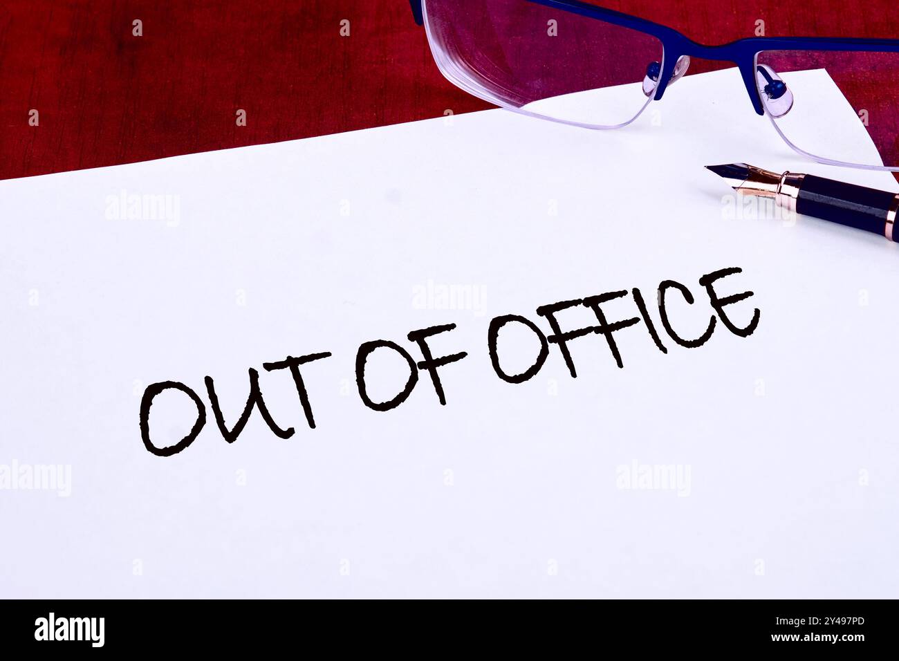 OUT OF OFFICE words written on a blank sheet there is an inscription ...