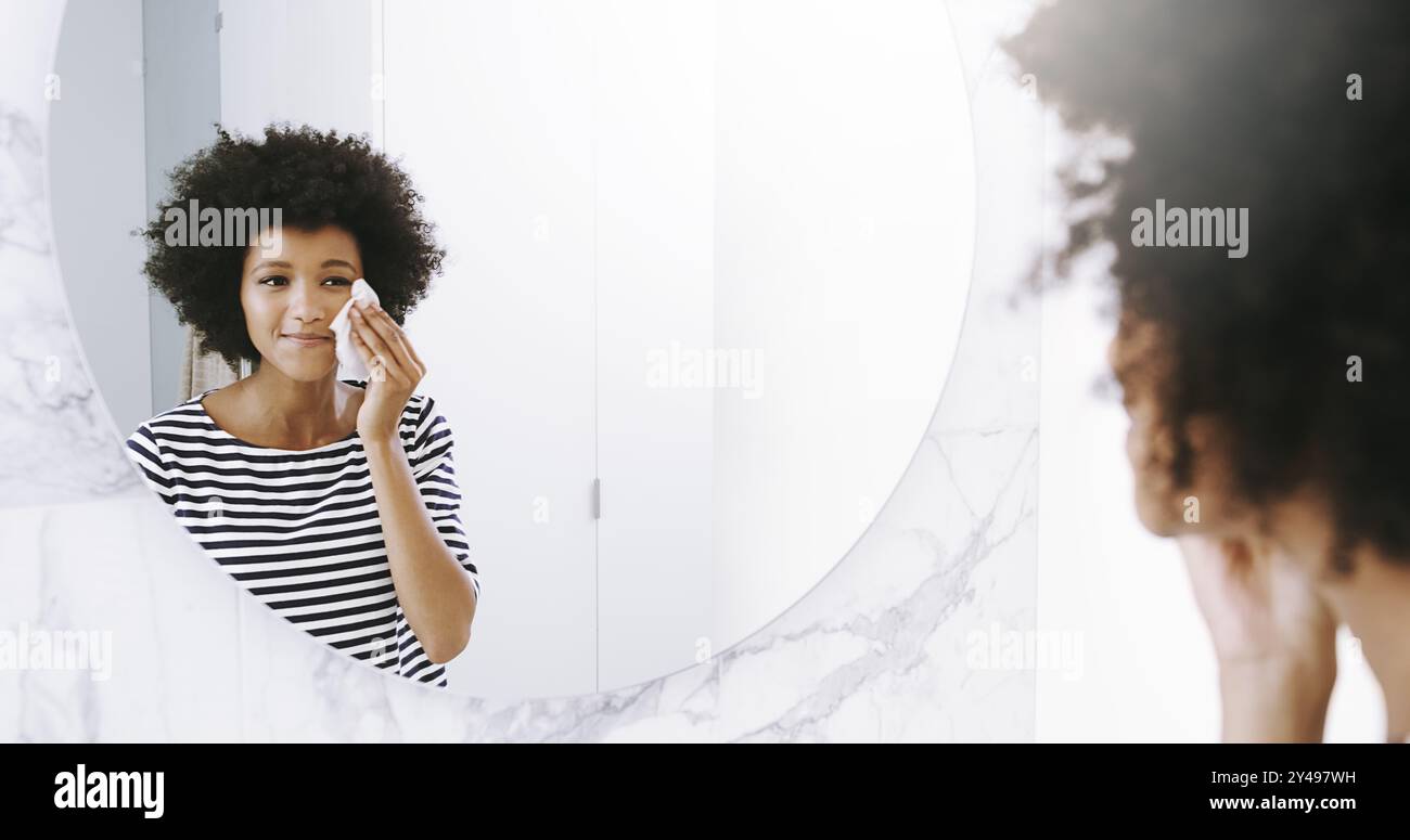 Wipe, mirror and woman in bathroom with tissue, cleanser or morning ...
