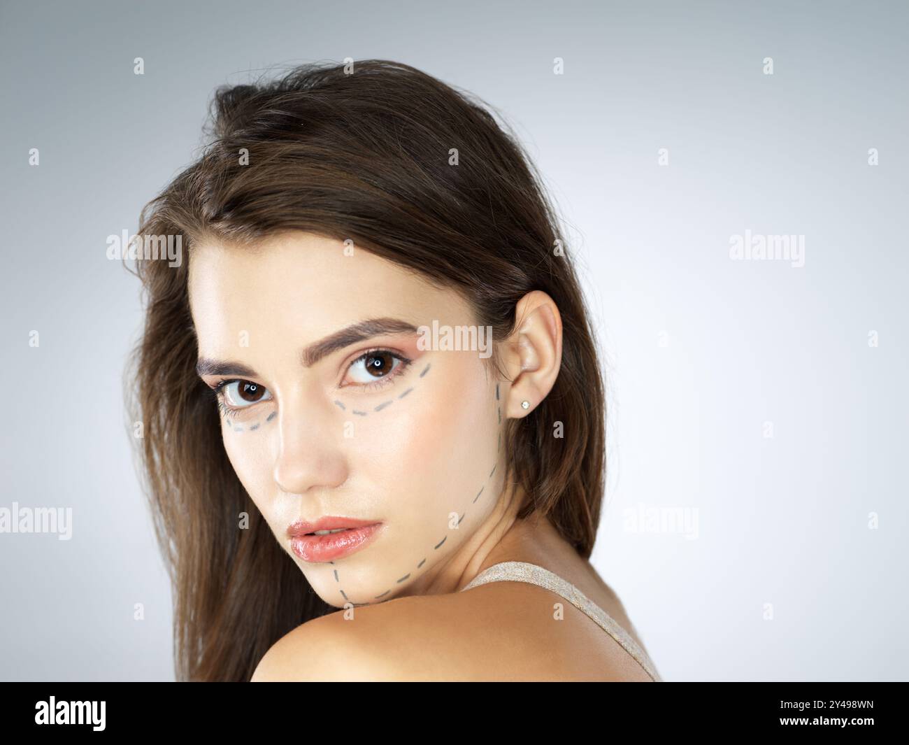 Woman, portrait and mark in studio for plastic surgery, chin ...