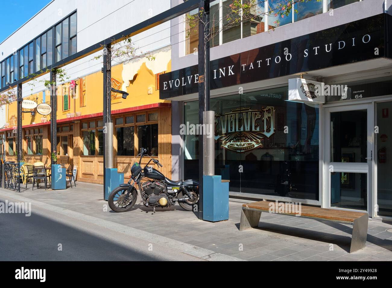 Evolve Ink Tattoo Studio with a motorbike at the front and Caruggi ...