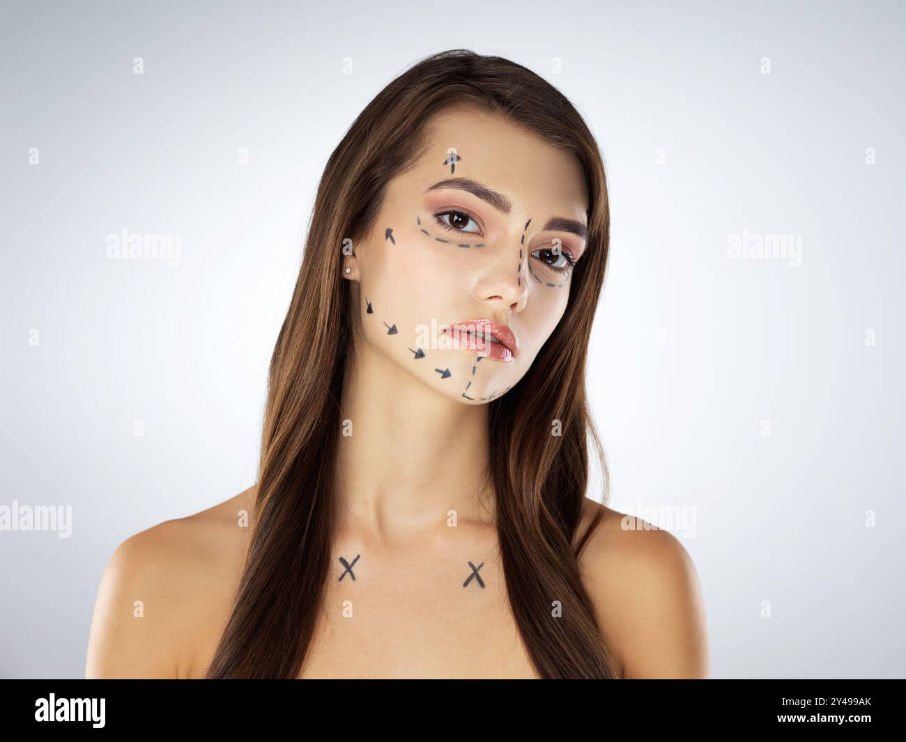 Woman, portrait and arrow in studio for plastic surgery, chin ...