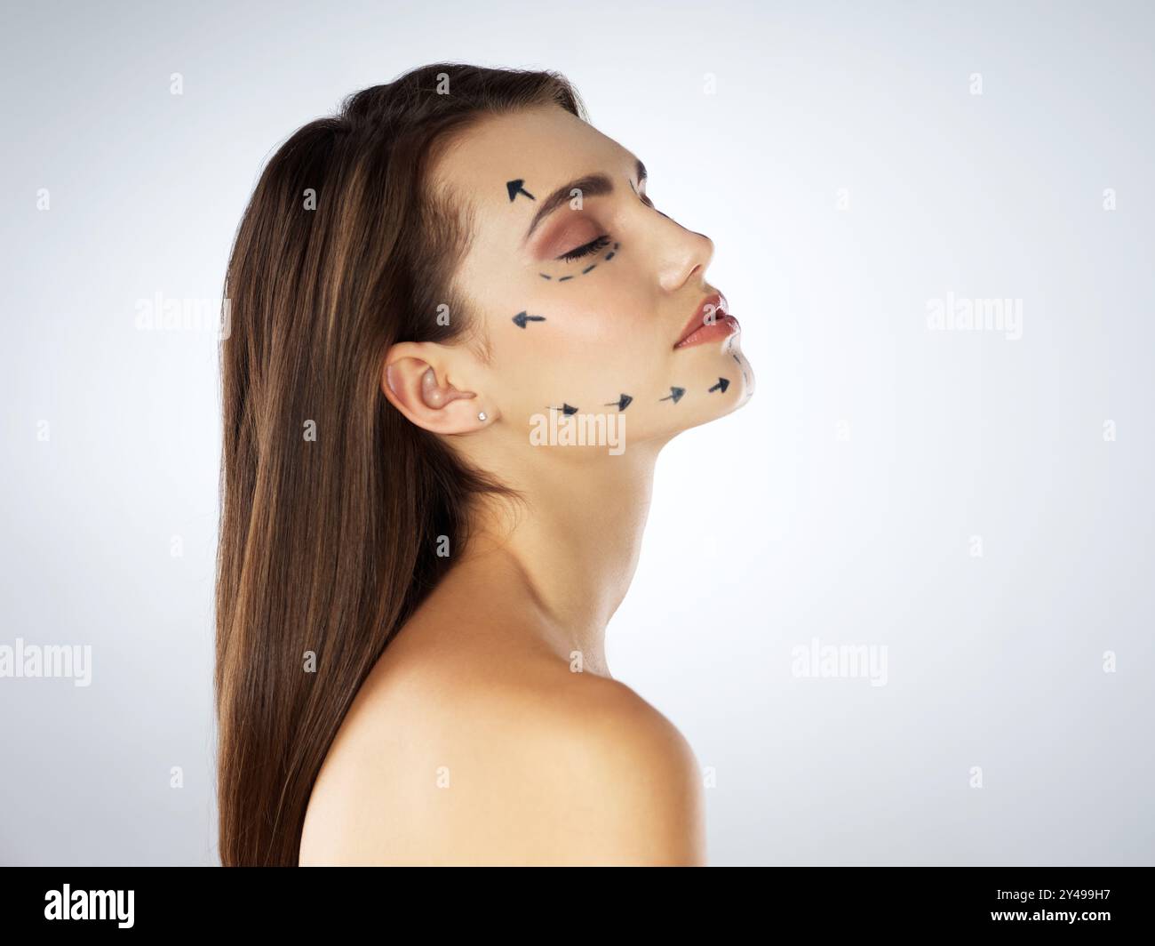 Female person, face and arrows in studio for plastic surgery, chin ...