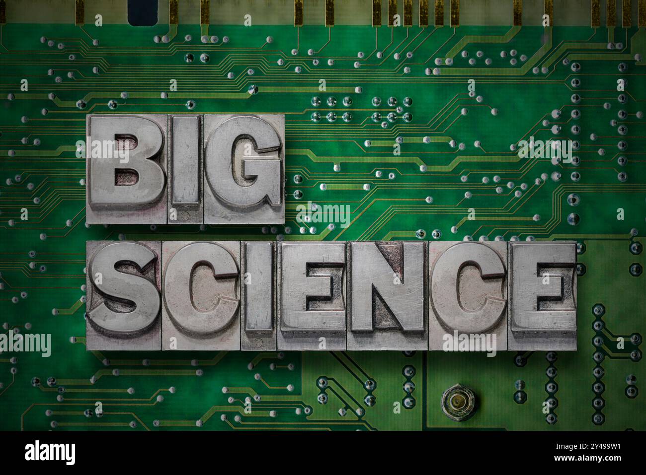 big science phrase made from metallic letterpress blocks on the green ...