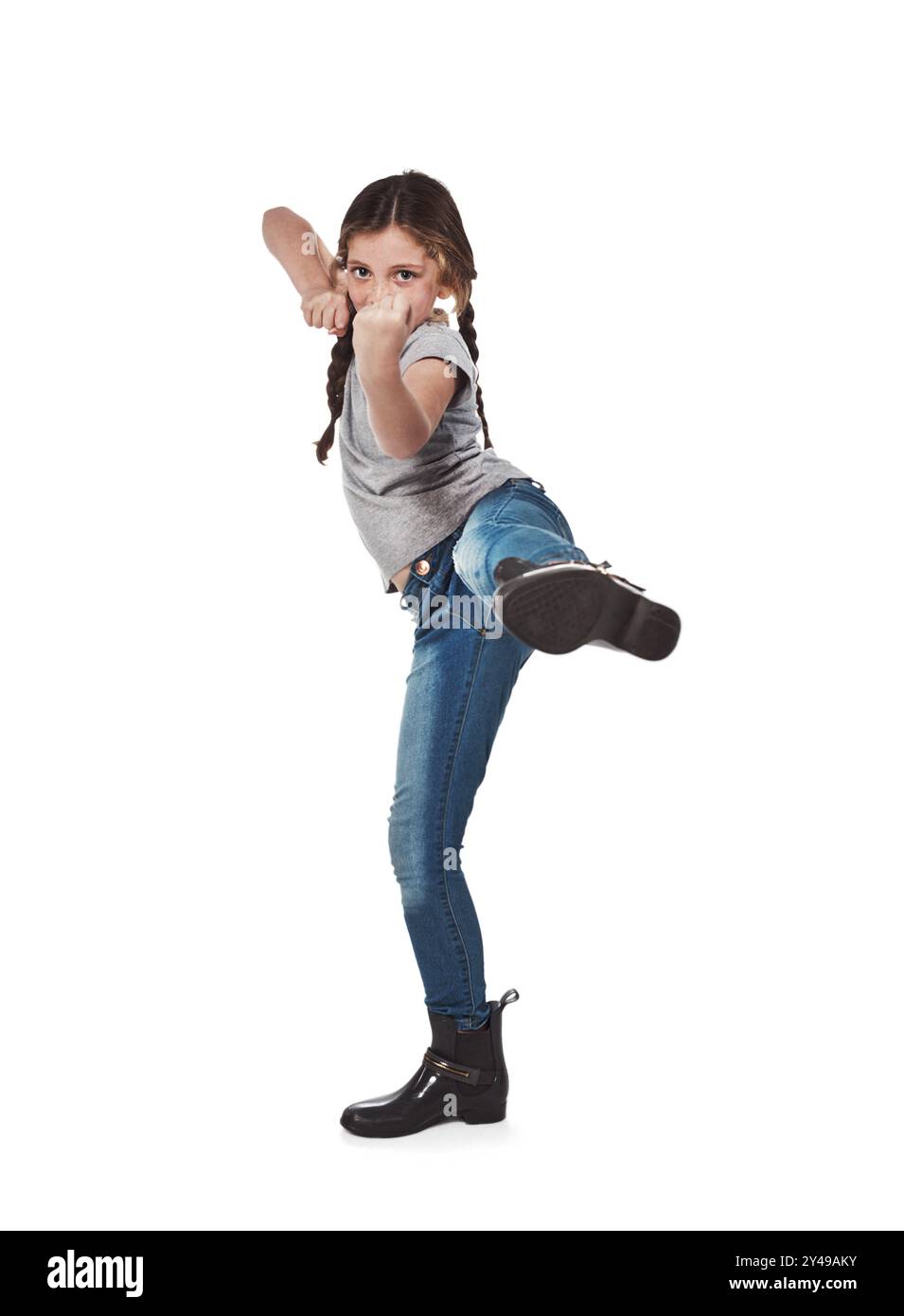 Kid, girl and kick in studio on portrait for self defense and fighting ...