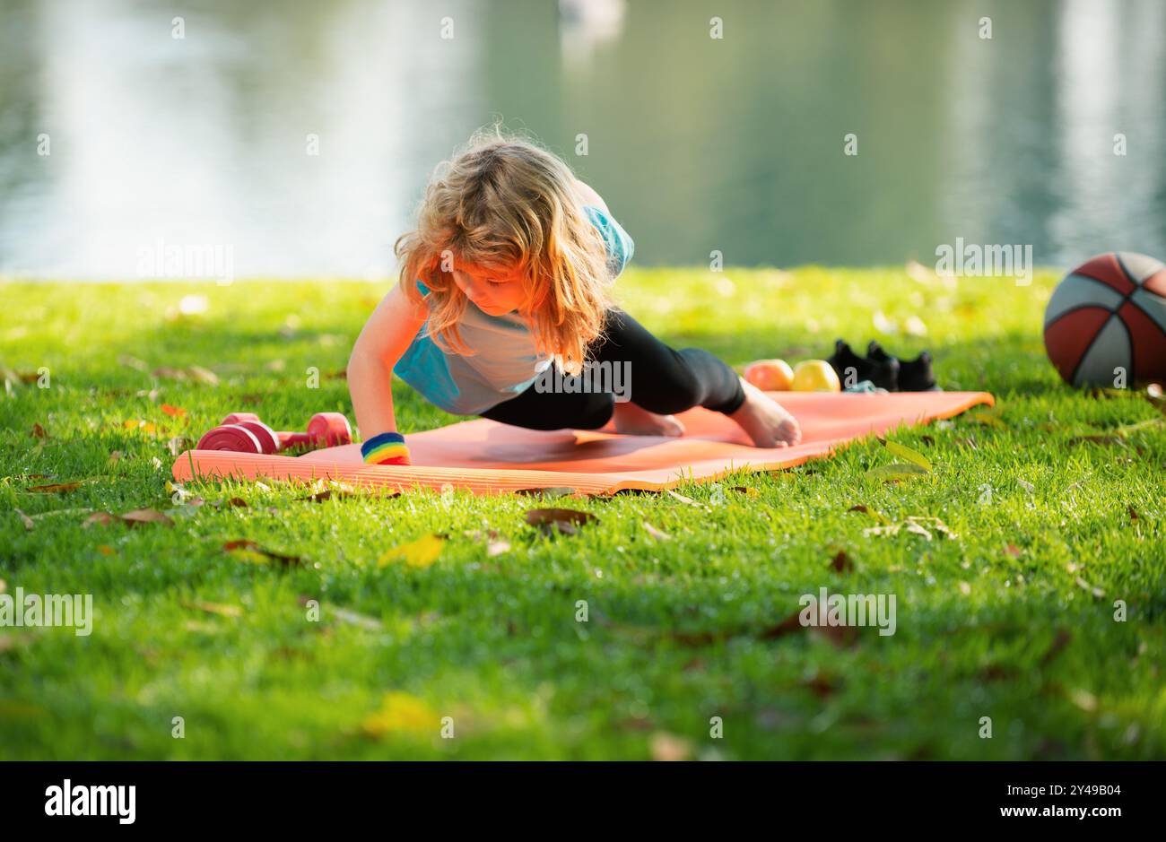 Kid pushing up. Boy doing push up exercise outdoors. Healthy lifestyle ...