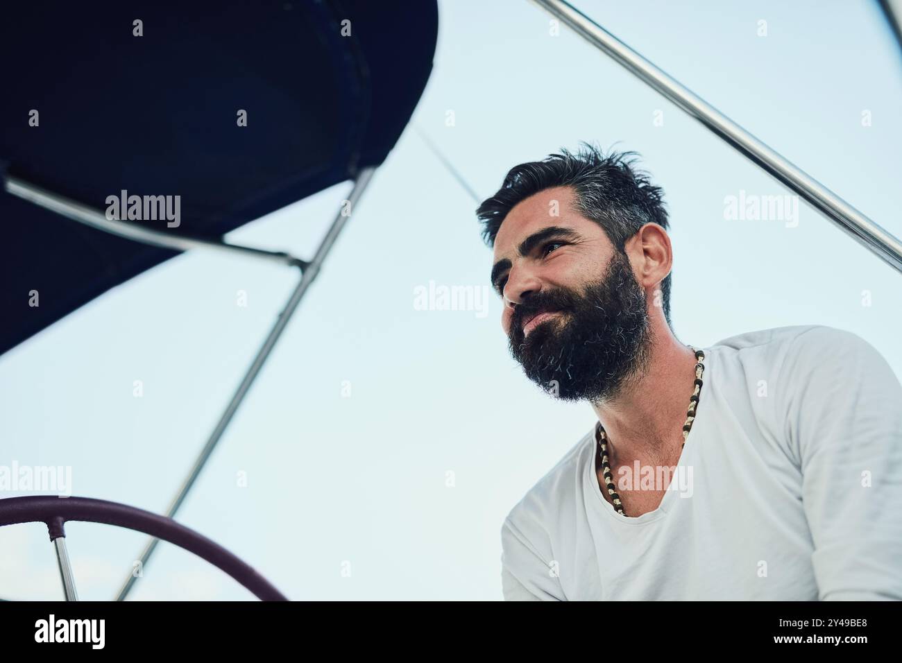 Captain, man and smile on yacht for relax, fun and adventure in ocean ...