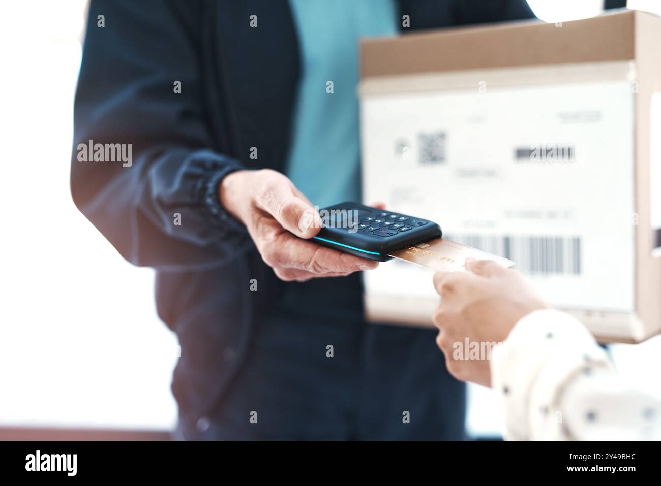 Delivery man, hands or credit card for payment on pos machine ...