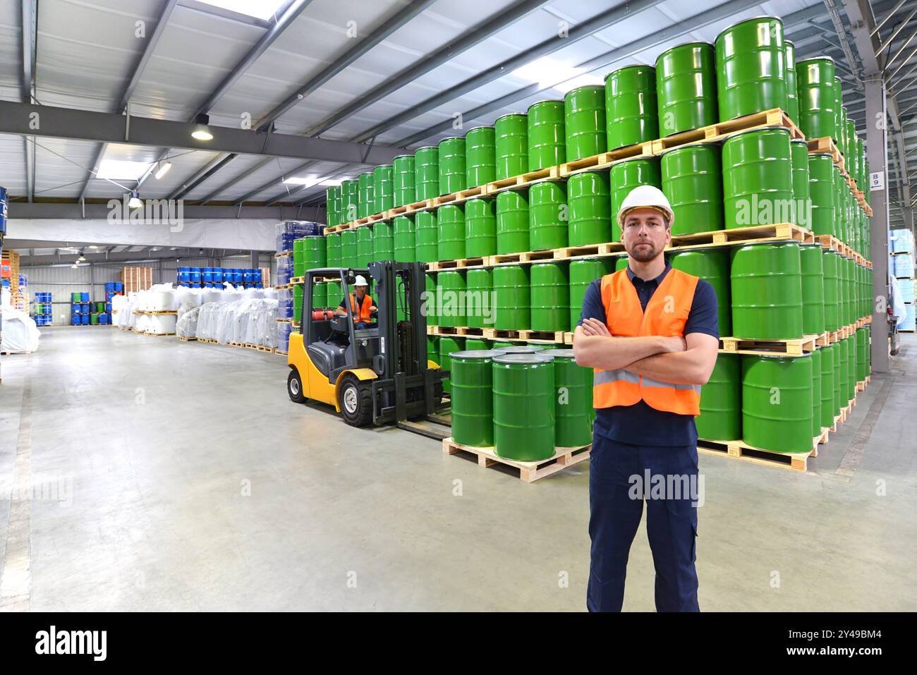 group of workers in the logistics industry work in a warehouse with ...