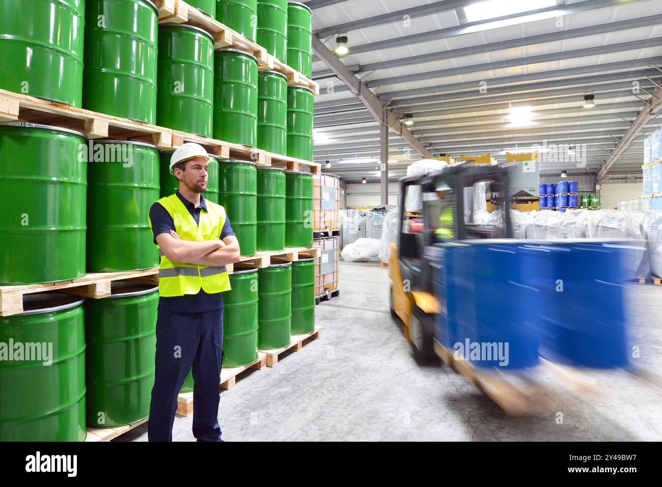 group of workers in the logistics industry work in a warehouse with ...