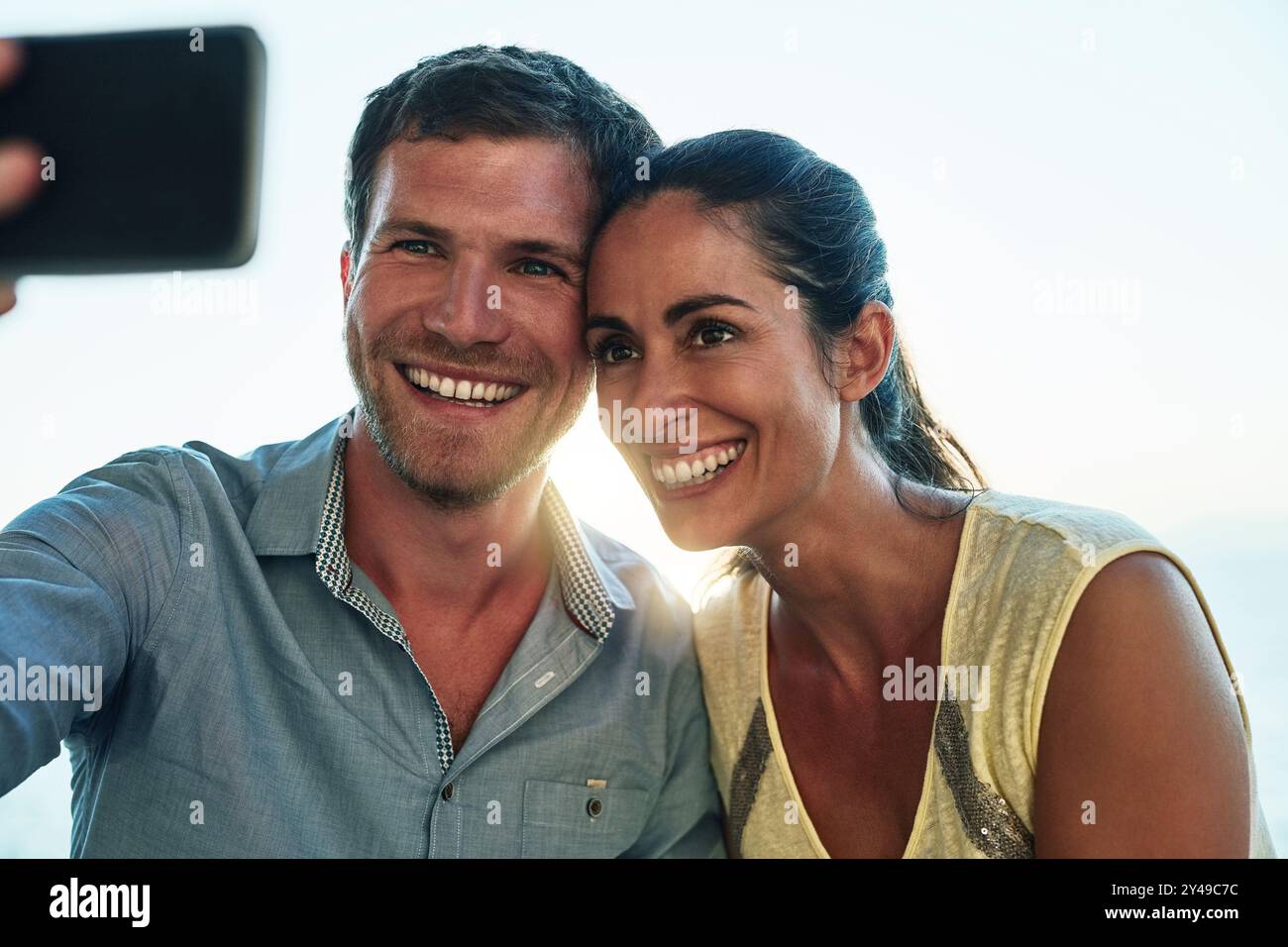 Outdoor, couple and happy with selfie on date for social media post and ...