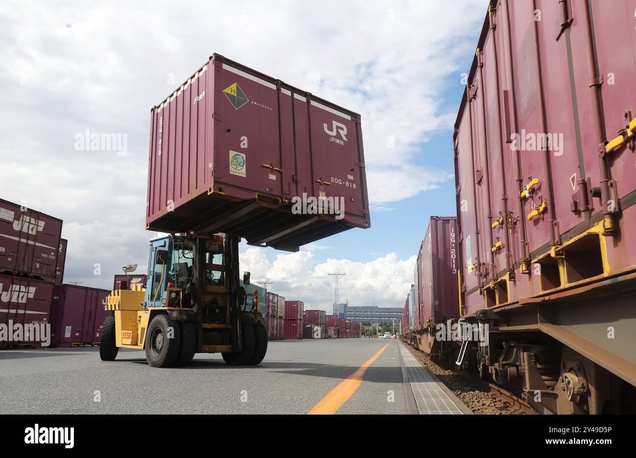A container is loaded on a freight train in Tokyo on August 8, 2023 ...