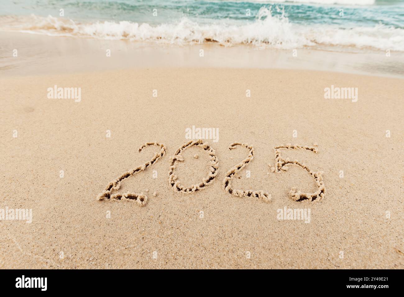 Christmas inscription 2005 on the beach Stock Photo - Alamy