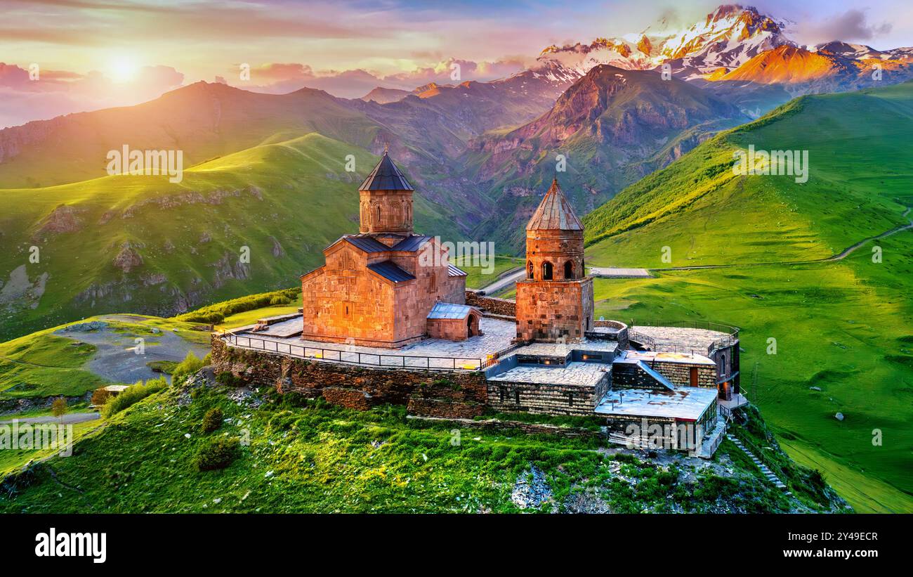 Aerial view of Gergeti trinity church at sunrise in Georgia Stock Photo ...