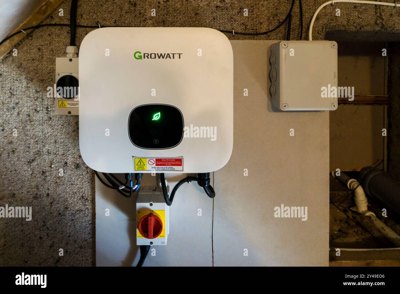 Growatt solar PV inverter in loft of house with solar panels. Converts ...