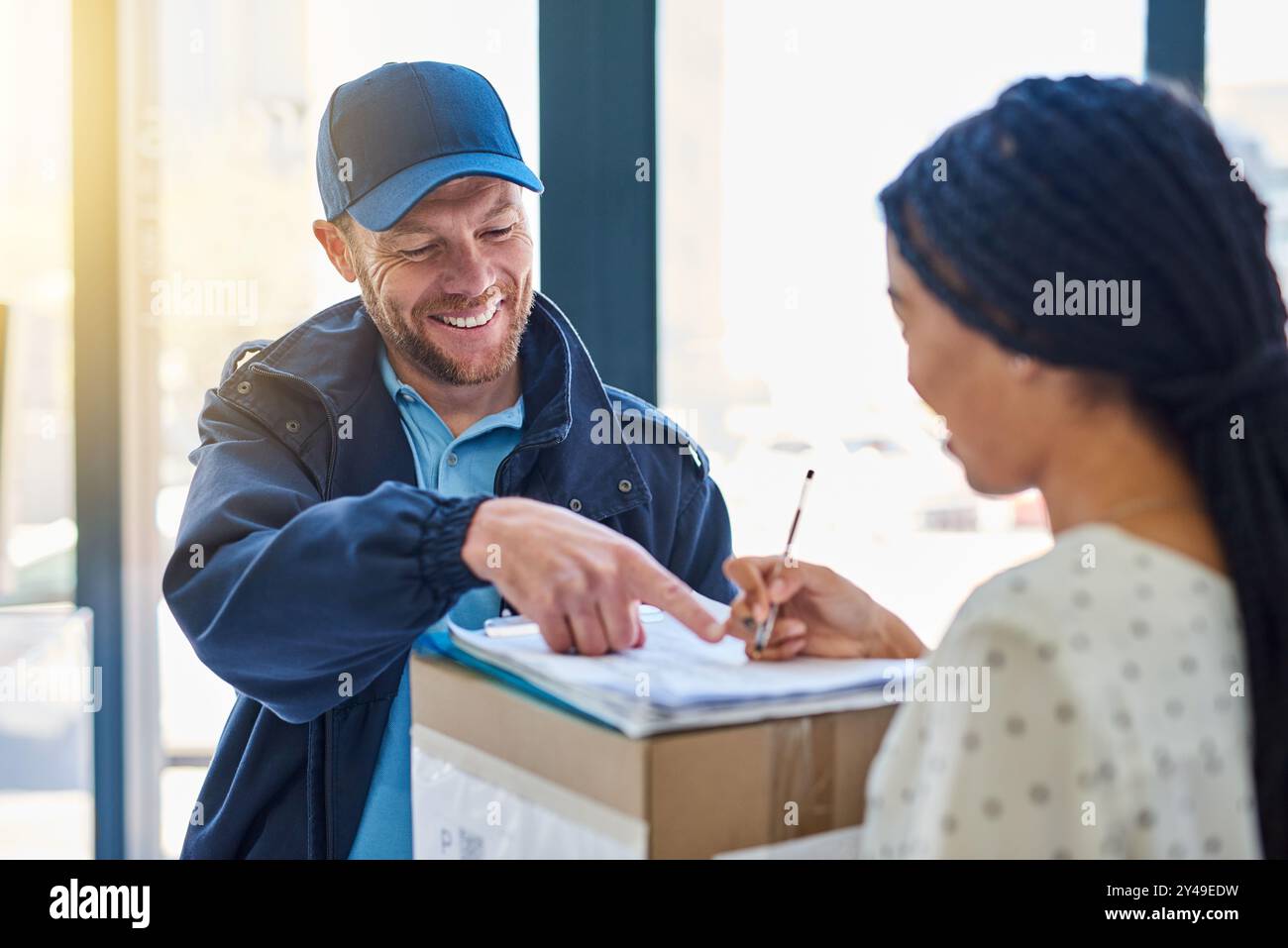 Delivery man, signature and customer with clipboard for stock and ...