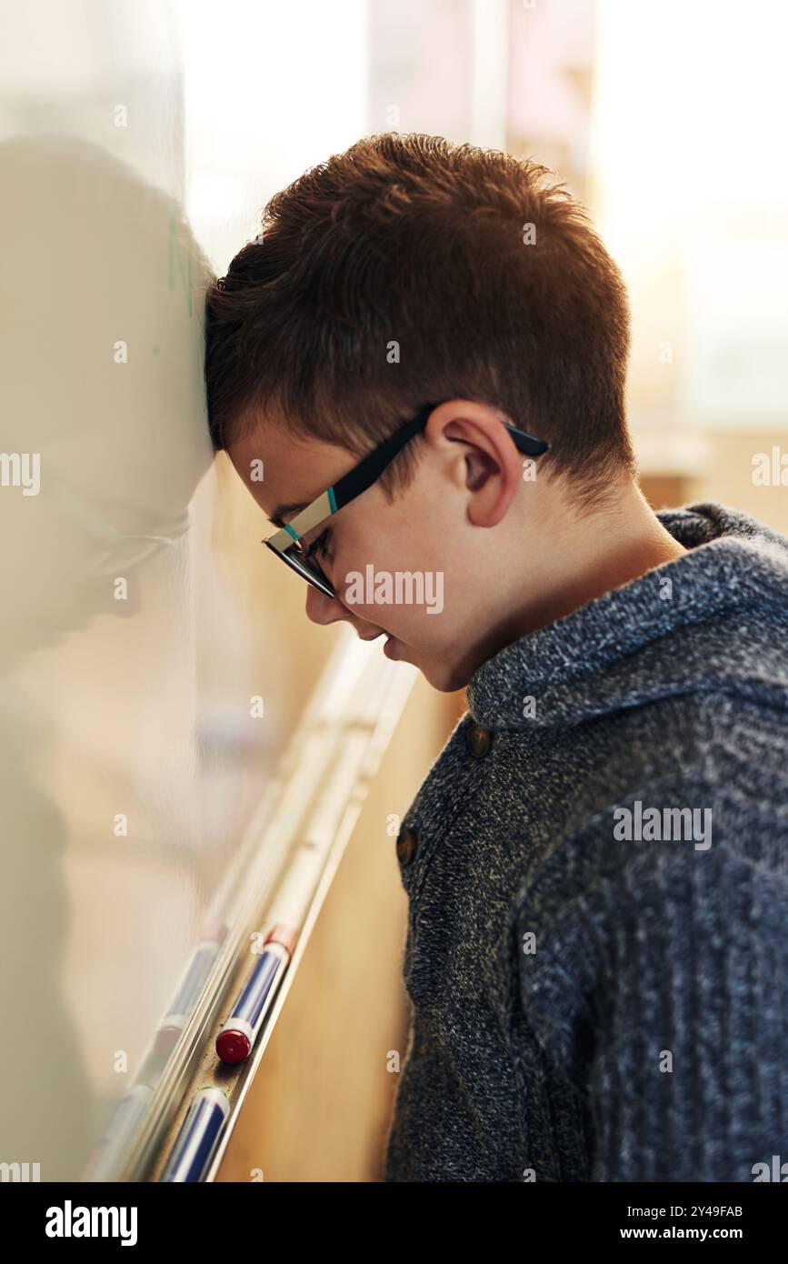 Class, board and frustrated boy kid with math problem solving, thinking ...