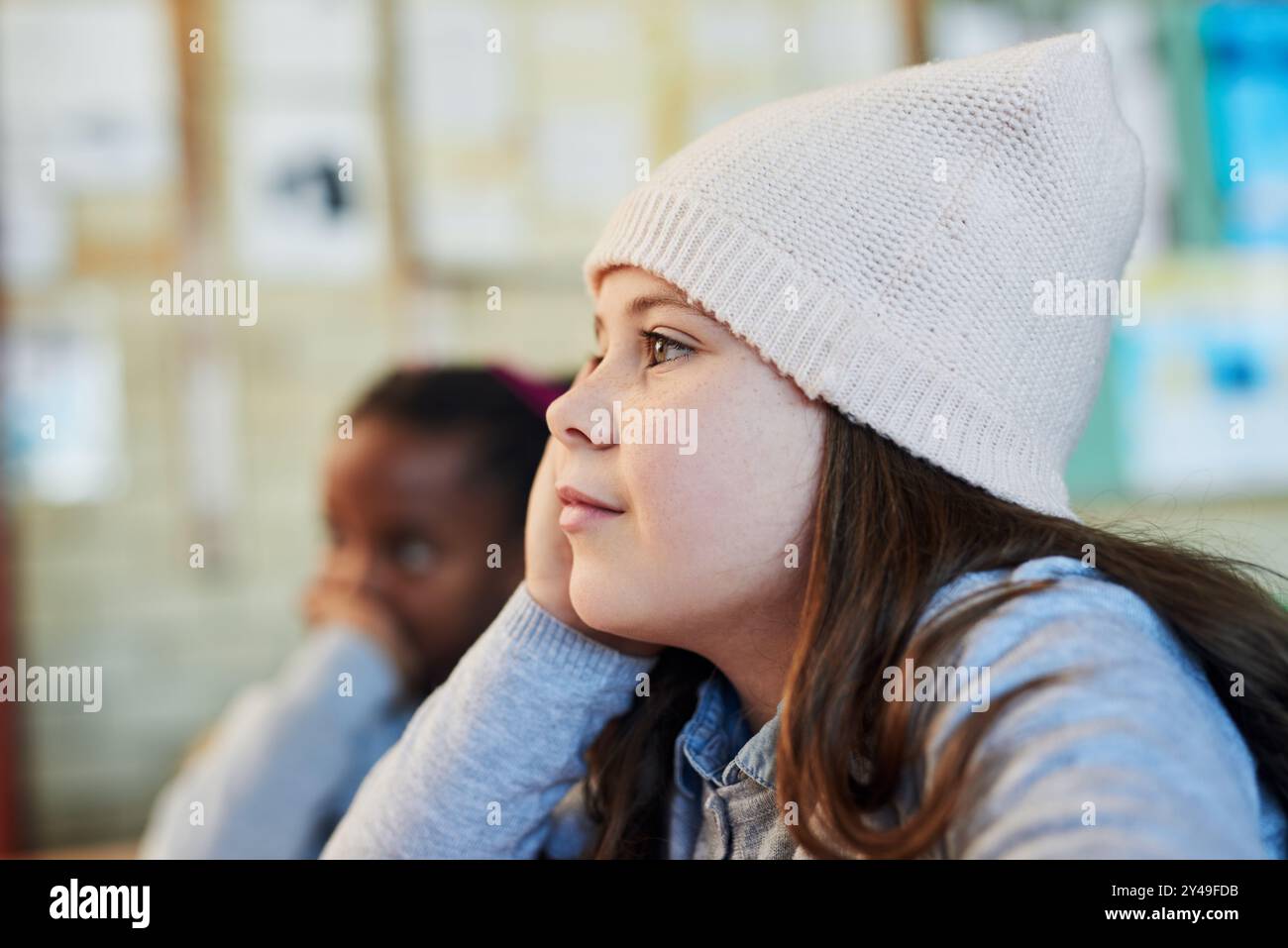 Kid, girl and serious in classroom for education with learning ...
