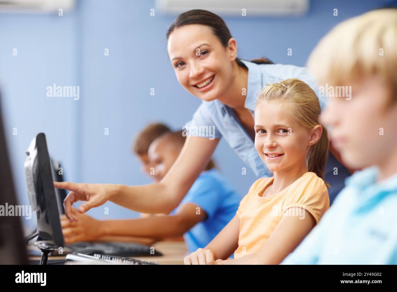 Portrait, woman and children in classroom, computer and teaching of ...