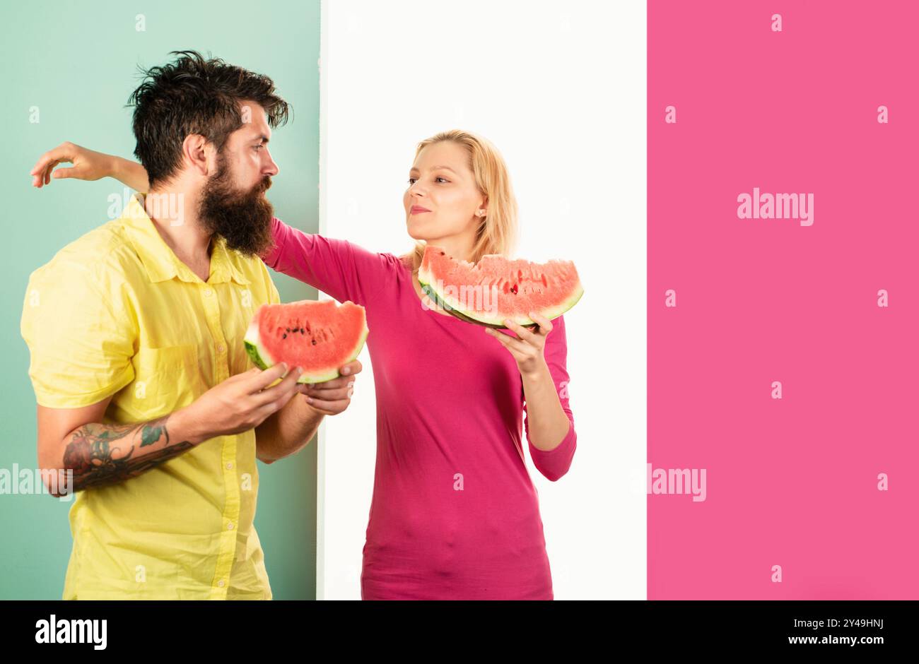 Two friends of woman and man enjoying a watermelon. Friends eating a ...